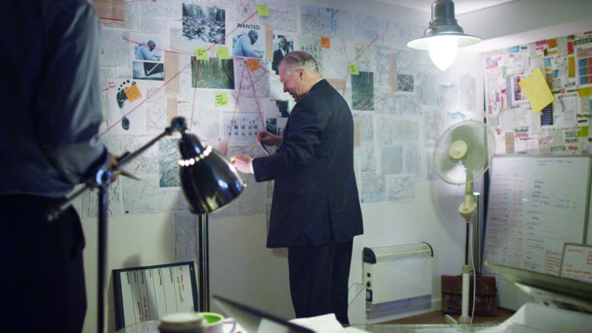 Stock Video Clip of 4K Police detectives working together in incident ...